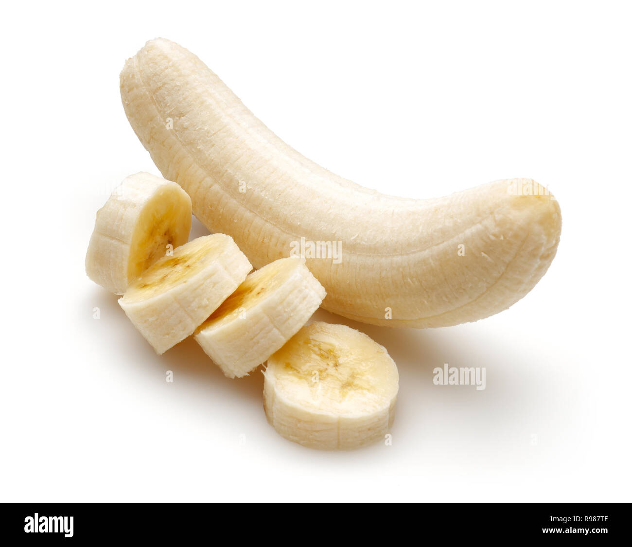 Peeled and sliced bananas isolated on white background. Studio shot ...