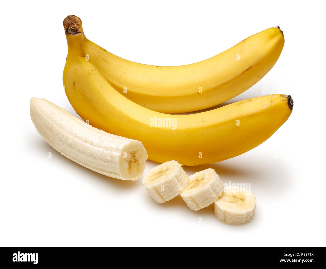 Peeled and sliced bananas isolated on white background. Studio shot ...