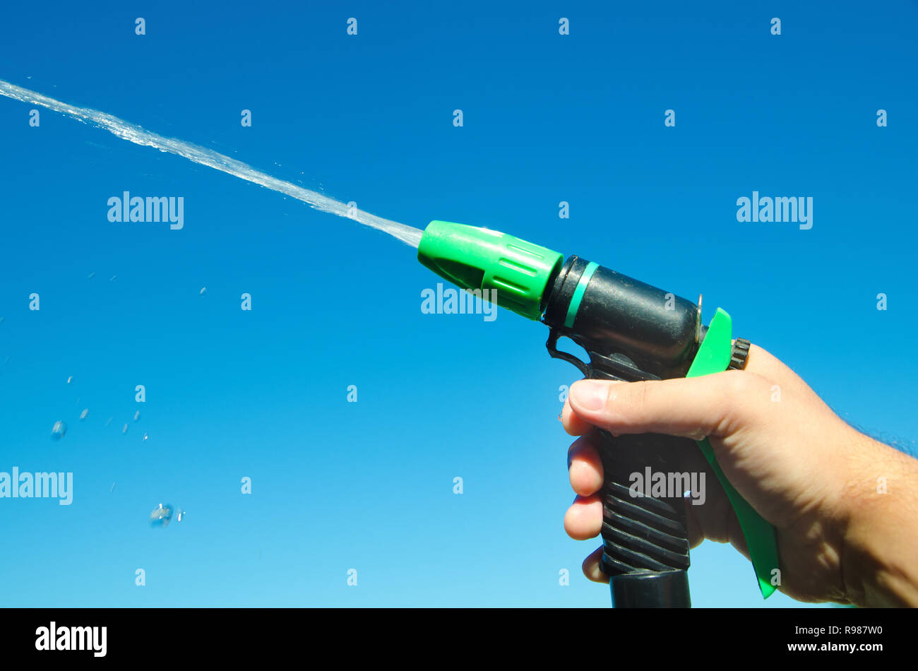 hand with water spray jet Stock Photo - Alamy