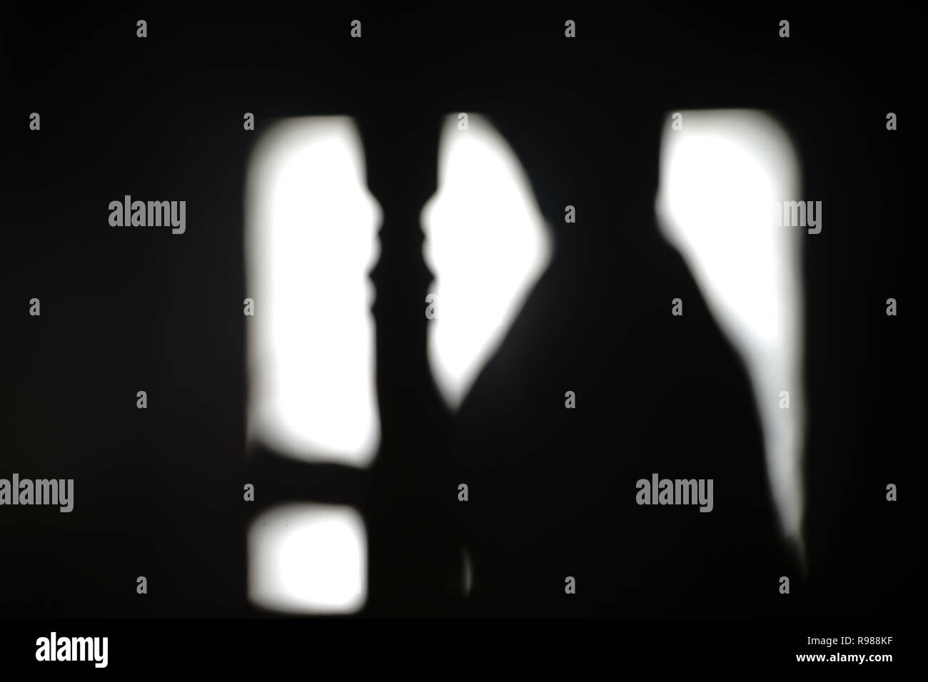 The black shadow of a silhouette behind the shadow of a palisade Stock ...