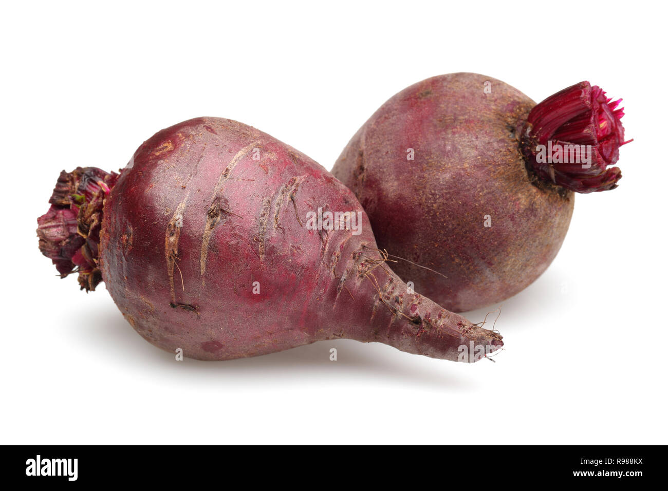 Two red beet roots isolated on white background Stock Photo - Alamy
