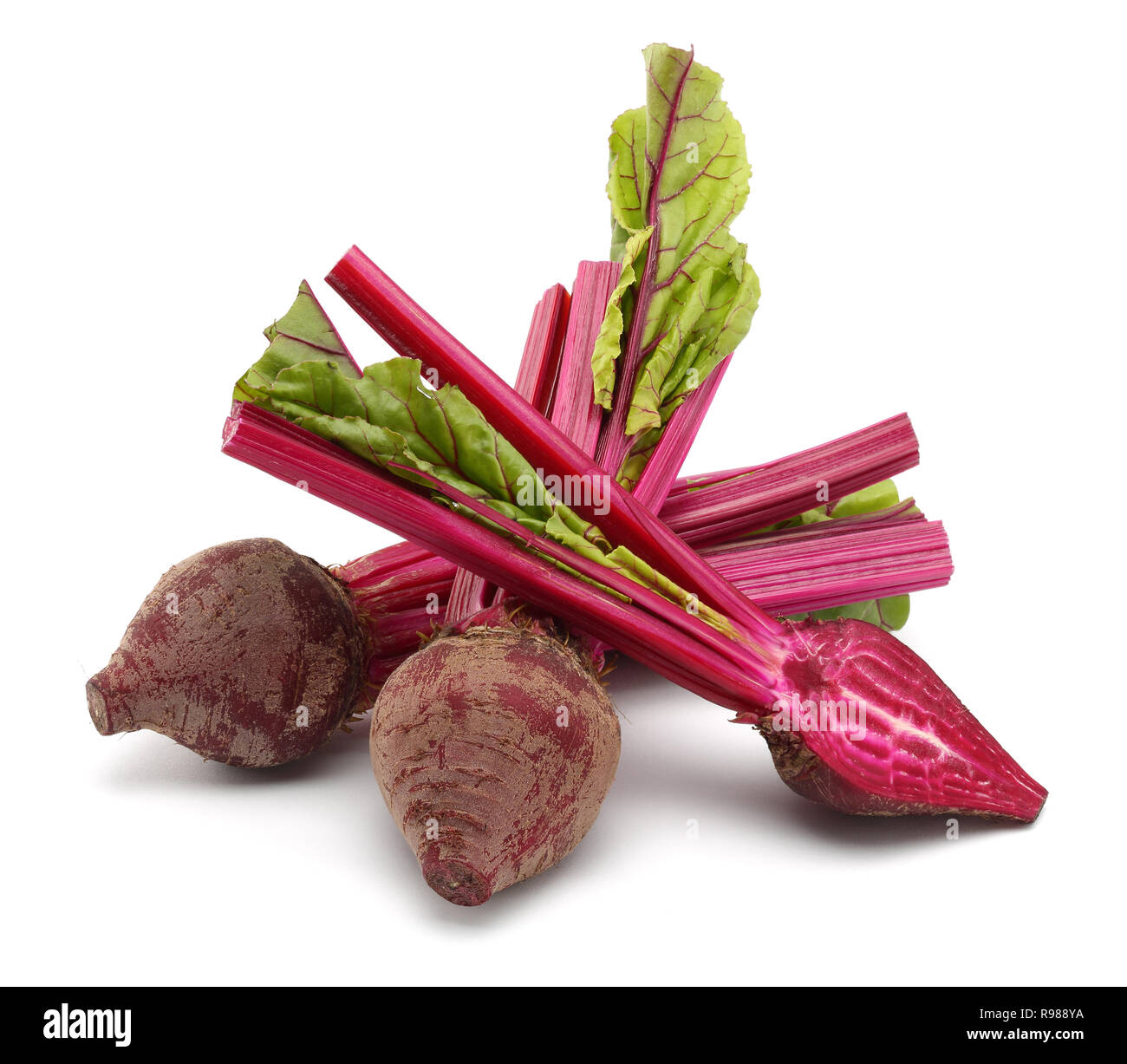 Fresh red beet roots and half with leaves isolated on white background ...
