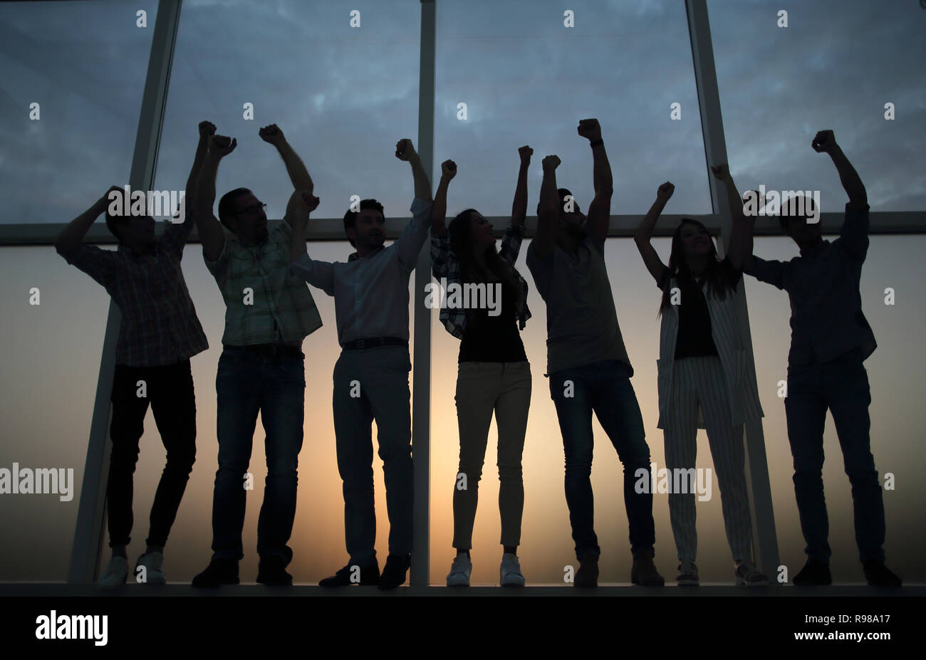 friendly business team standing near the office window Stock Photo - Alamy