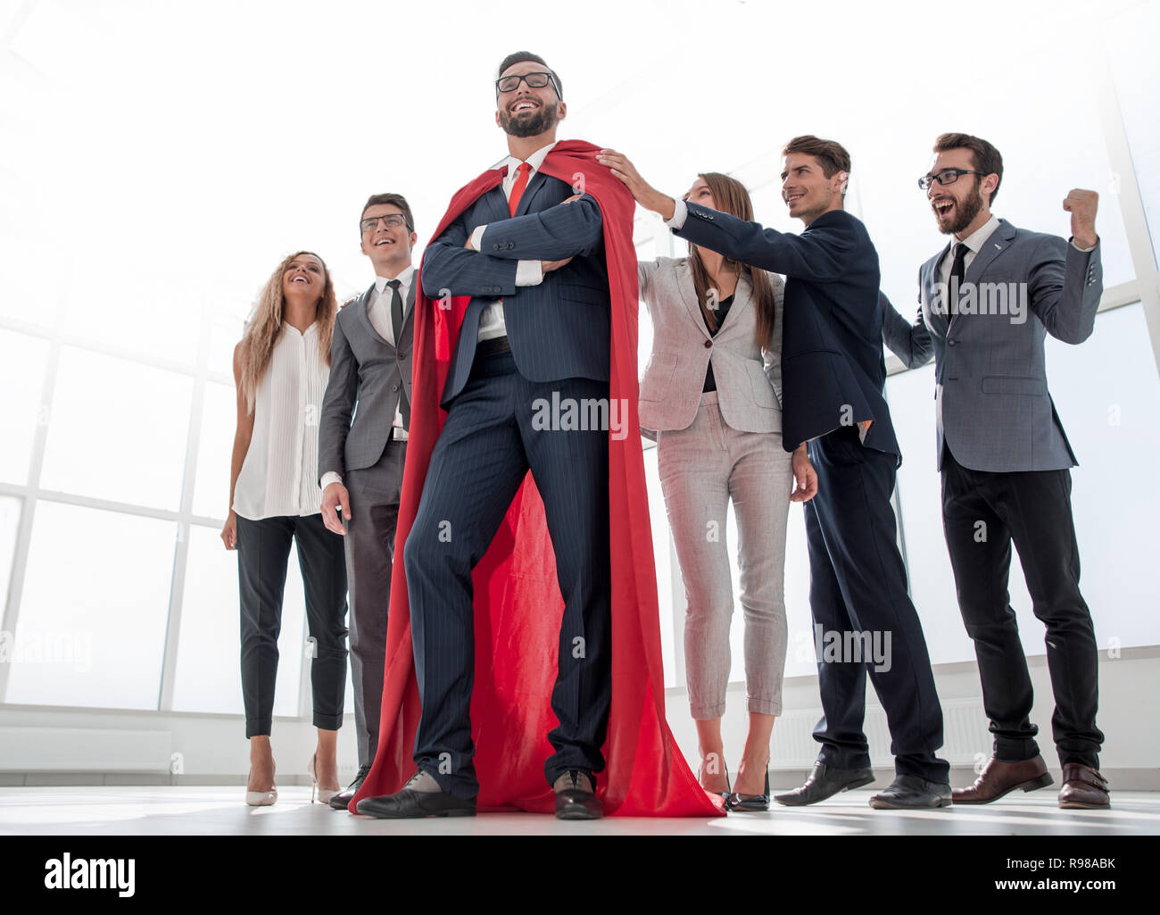 boss is a superhero and the business team is standing together Stock ...