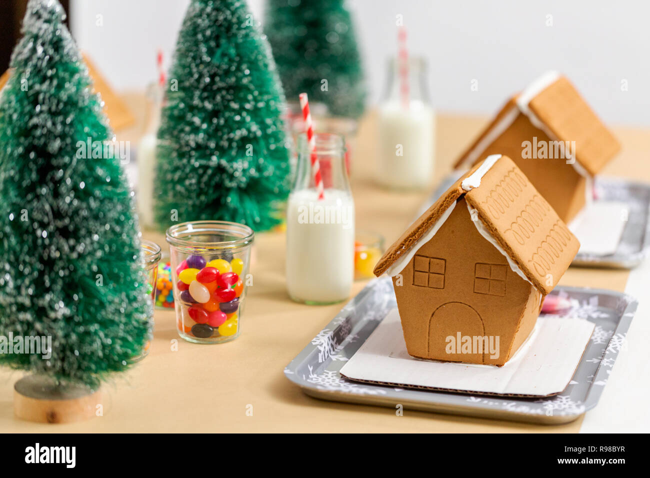 Kids party to decorate small gingerbread houses with candies Stock ...