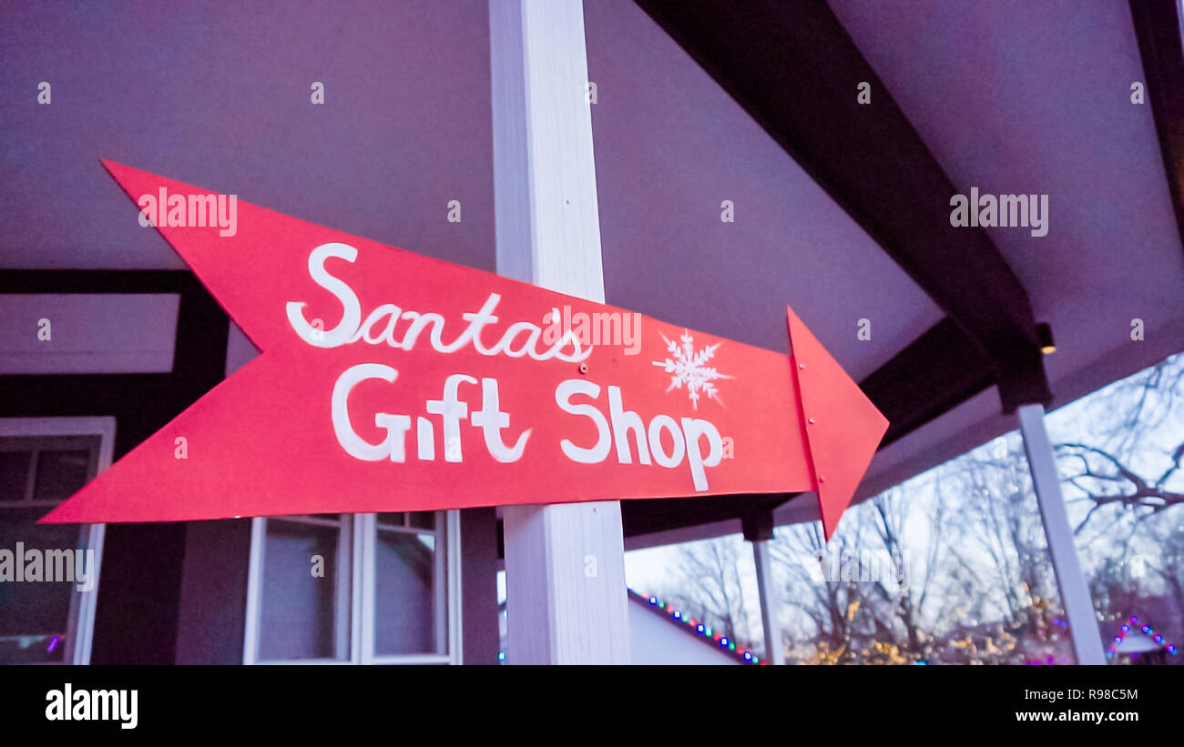 Red arrow with sign-Santa's Gift Shop on the building Stock Photo - Alamy