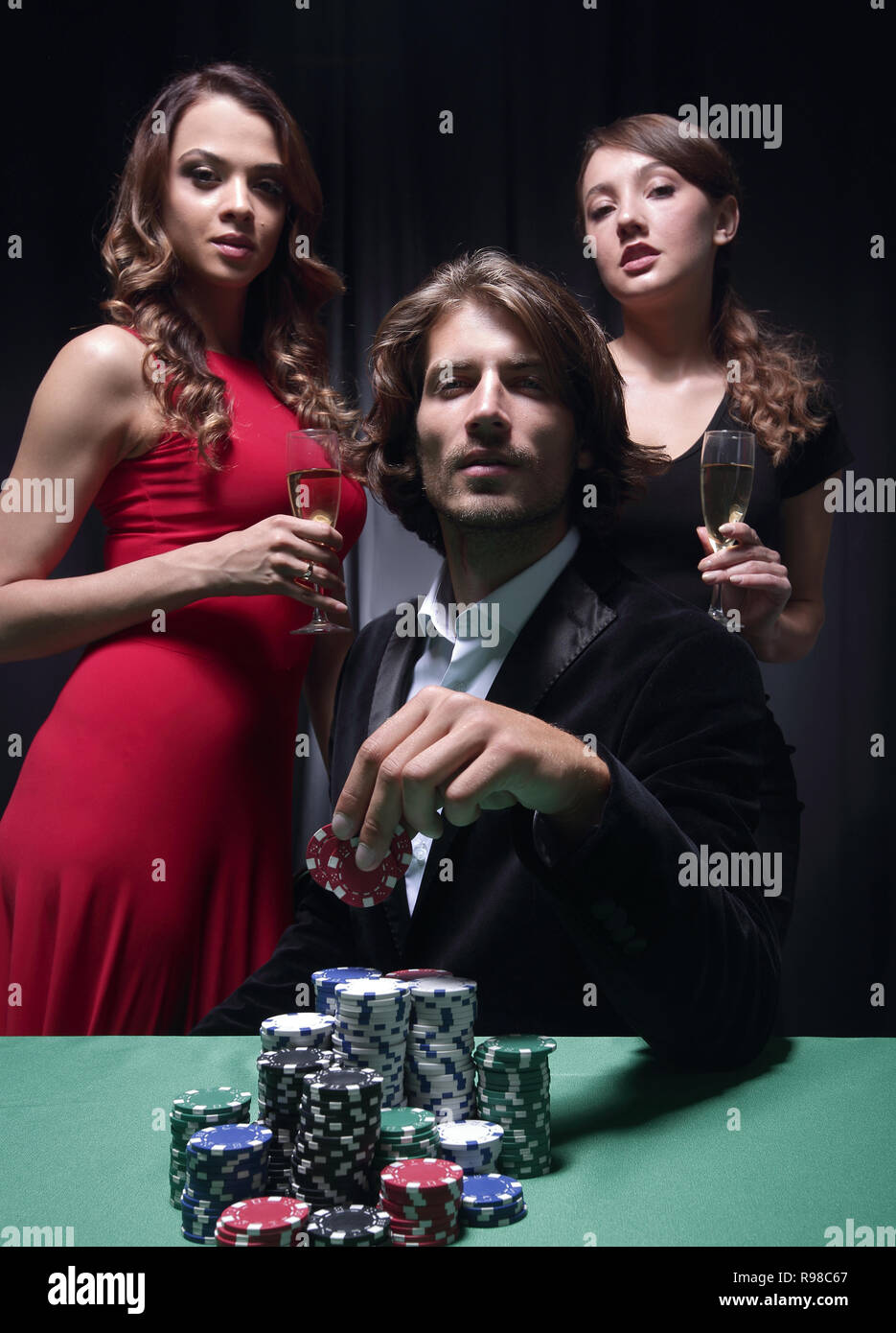 Man at roulette table surrounded by beautiful women Stock Photo - Alamy