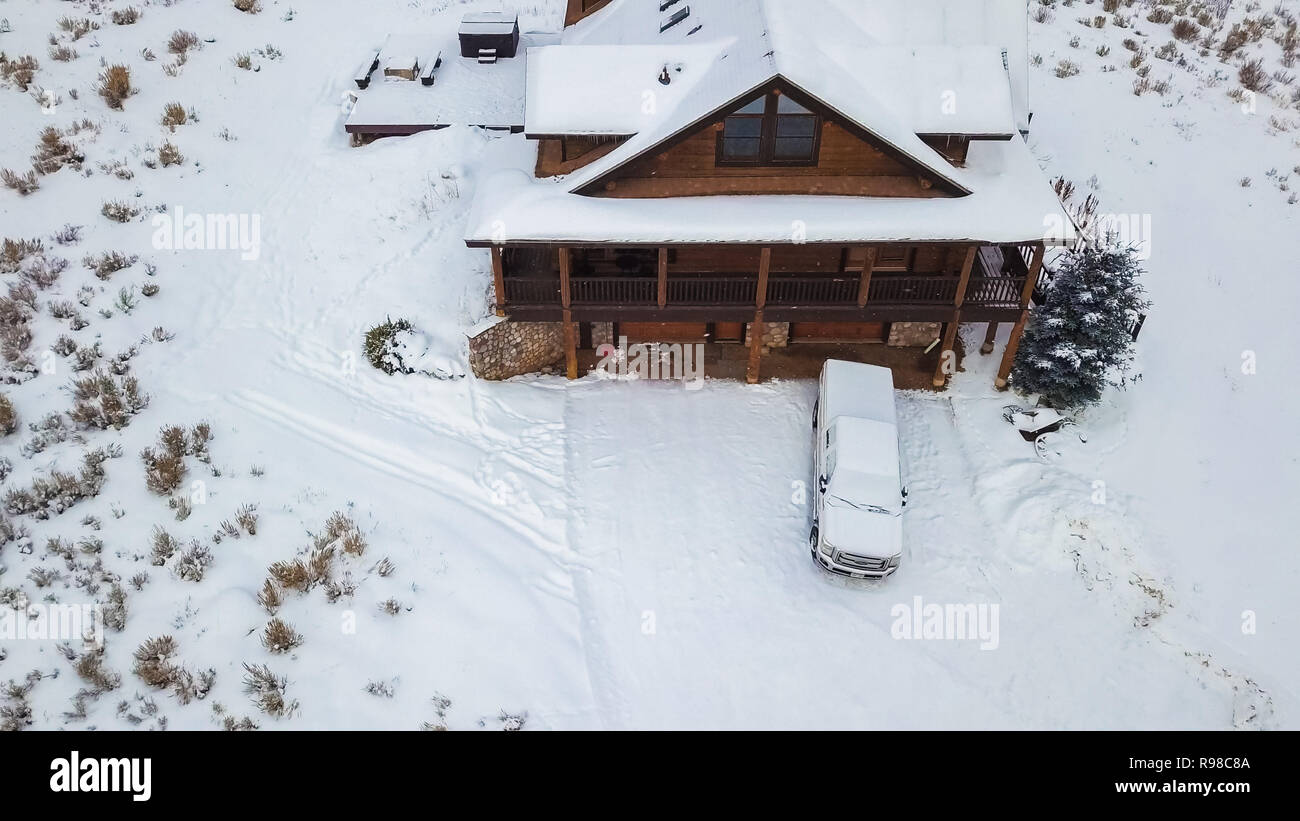Aerial view of the mountain house covered in snow in the Winter Stock ...