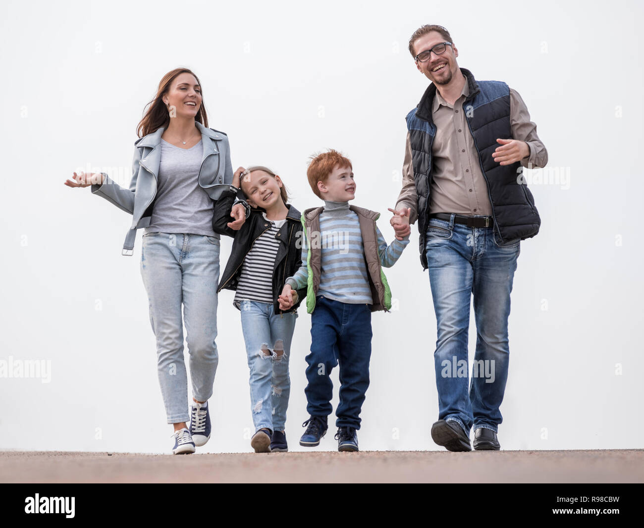 happy family having fun walking together Stock Photo - Alamy