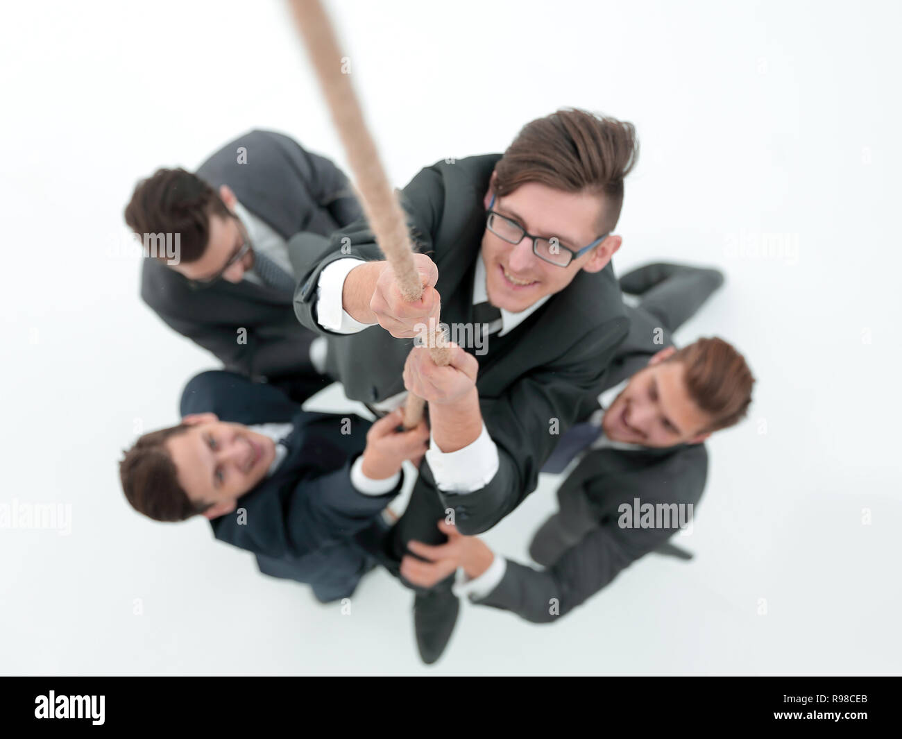 business team helping the leader to climb the rope Stock Photo - Alamy