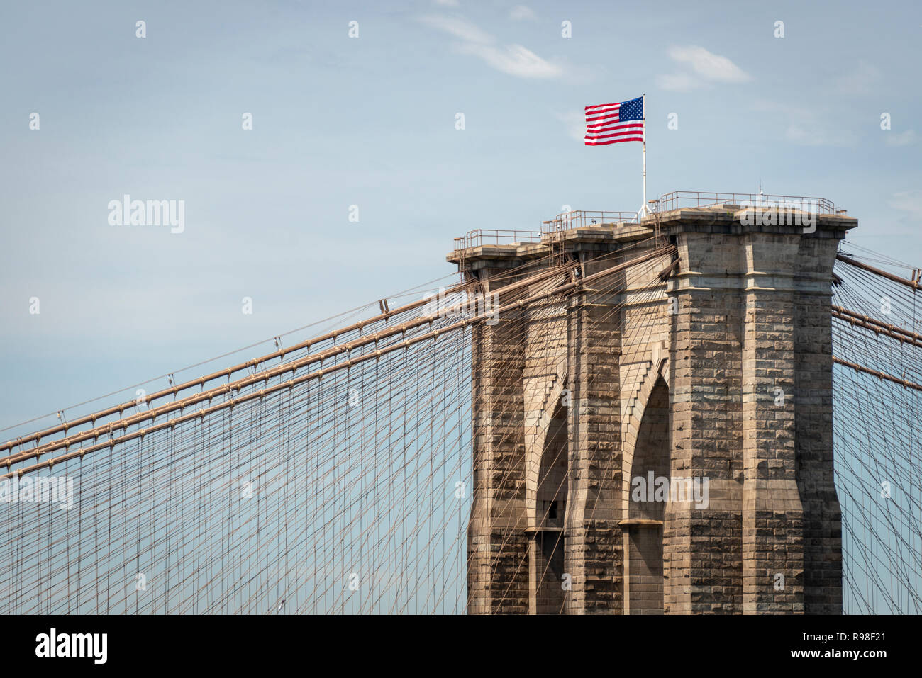 American flag flying on the Brooklyn Bridge, New York City Stock Photo ...