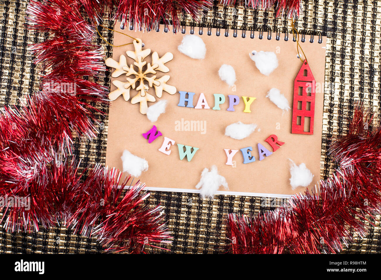 Notepad of kraft paper on a golden background with the inscription ...