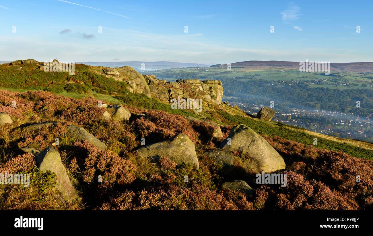 Scenic rural landscape of blue sky & early morning sun on rocky outcrop ...