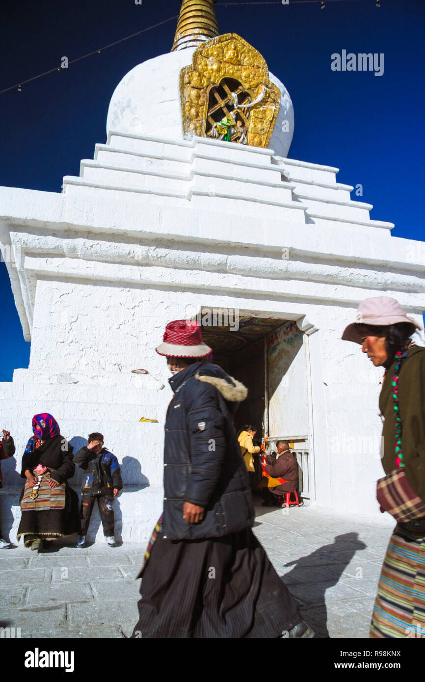 Lhasa, Tibet Autonomous Region, China : Tibetan pilgrims walk past a ...