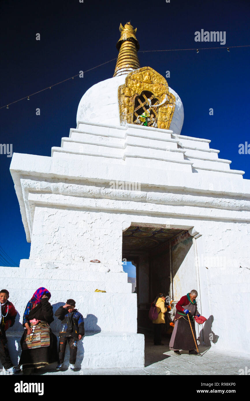 Lhasa, Tibet Autonomous Region, China : Tibetan pilgrims sit outside a ...