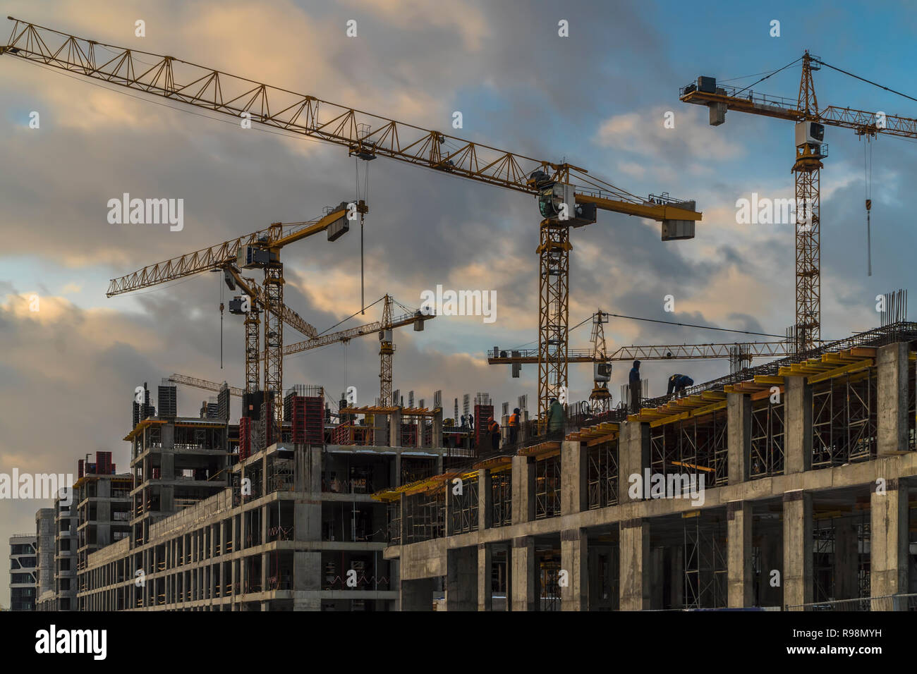 work of cranes on the construction of high-rise buildings Stock Photo ...