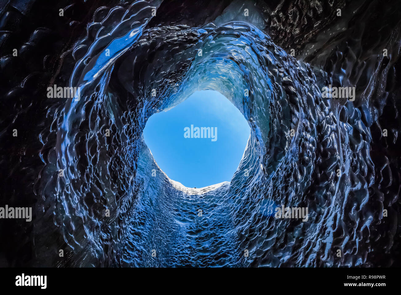 The melted vertical shaft of a moulin, aka glacier mill, the dramatic ...