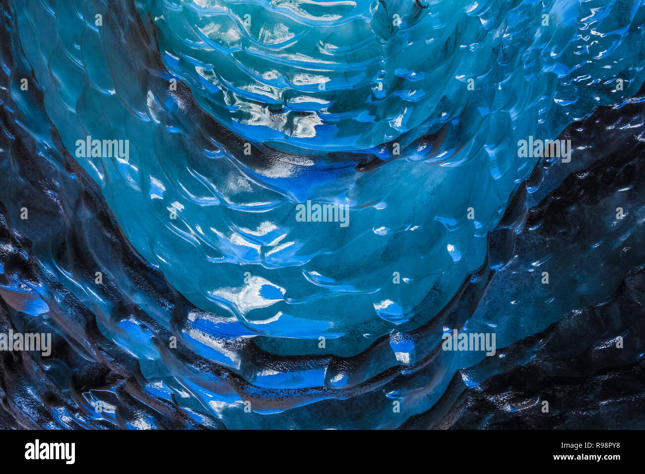 The melted sides of a vertical shaft of a moulin, aka glacier mill, the ...