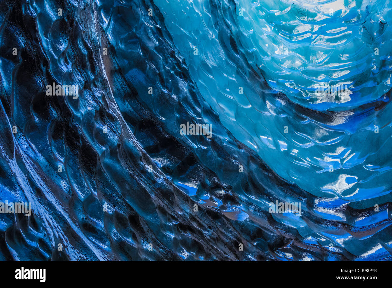 The melted sides of a vertical shaft of a moulin, aka glacier mill, the ...