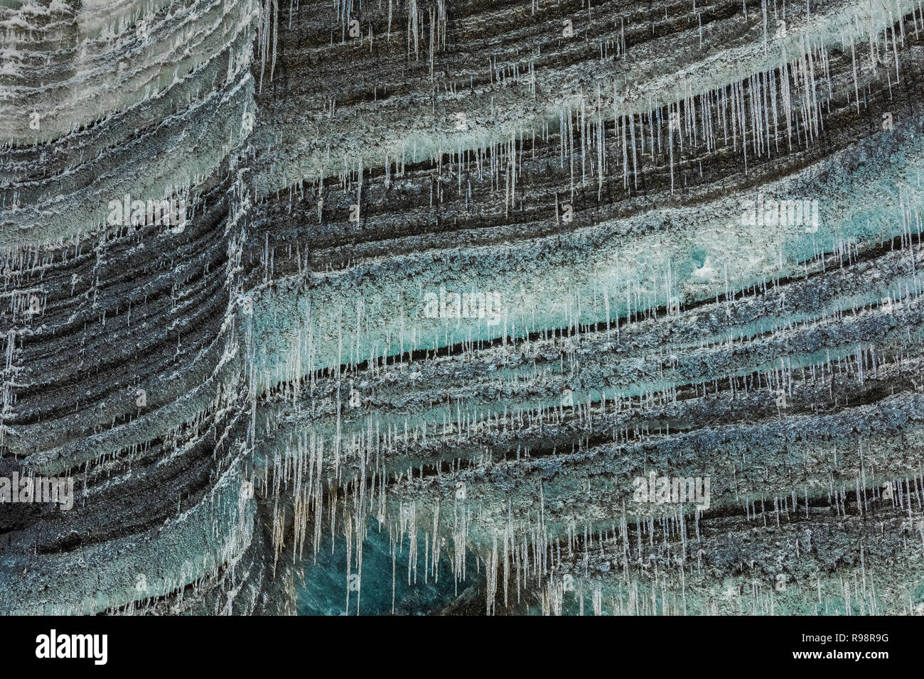 Icicles at entrance to an ice cave in a lobe of Mýrdalsjökull Glacier ...