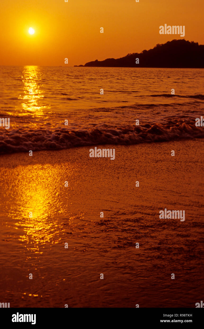 Palolem beach sunset goa Stock Photo - Alamy