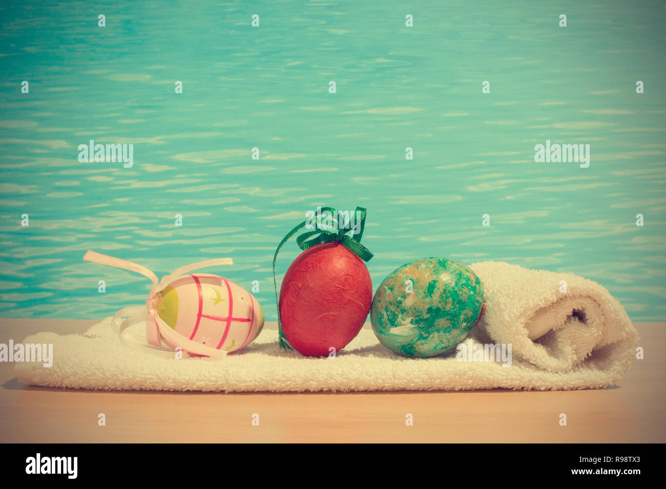 Easter in pool, wellness and relax. Eggs and water background for party ...