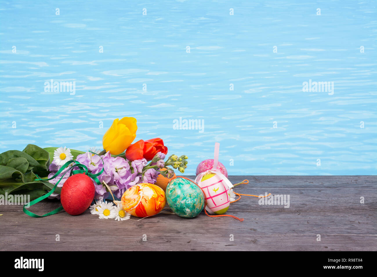 Easter in pool, wellness and relax. Eggs and water background for party ...