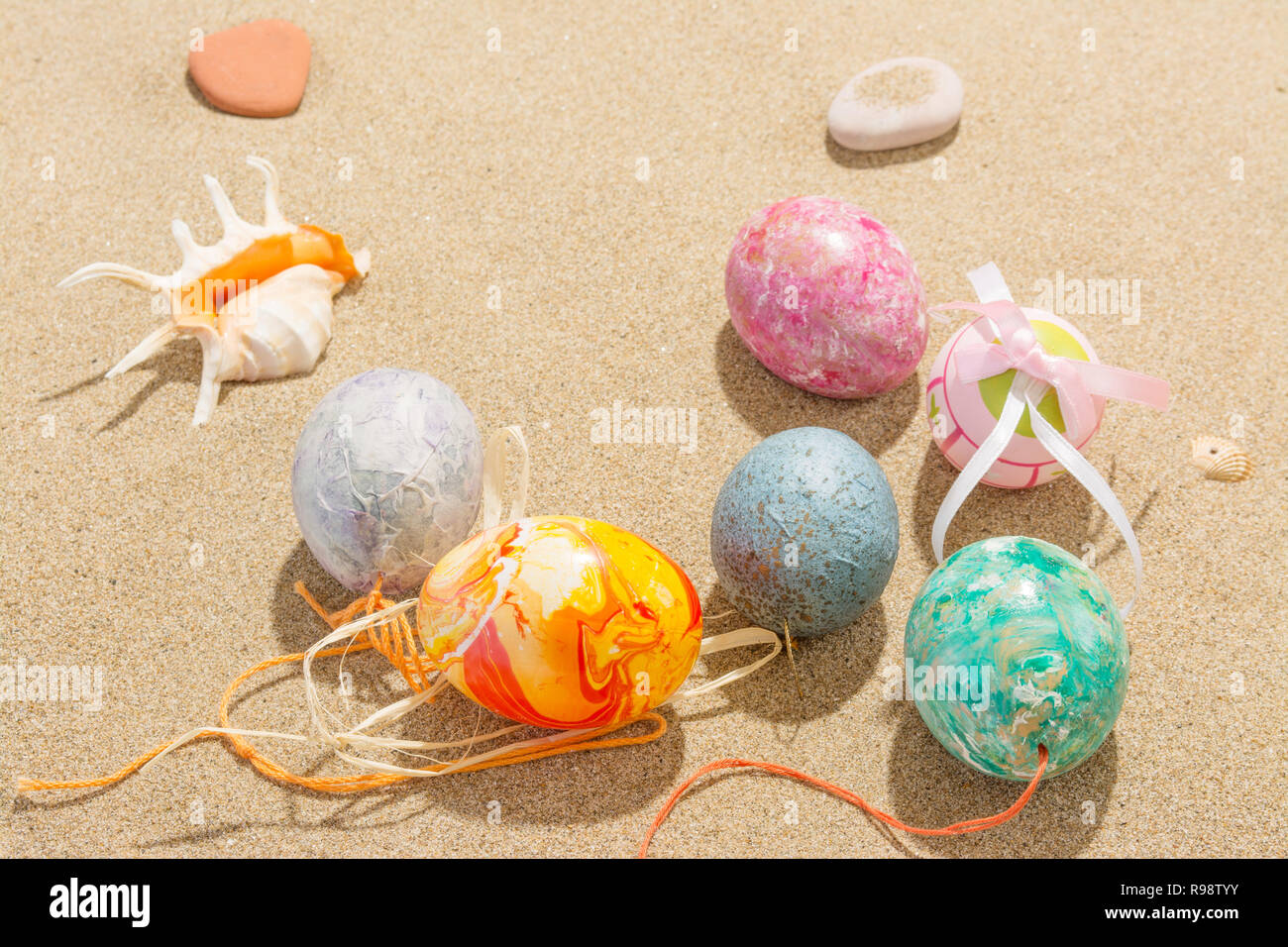 Easter on beach background. Eggs on the sandy by the ocean. Vacation ...