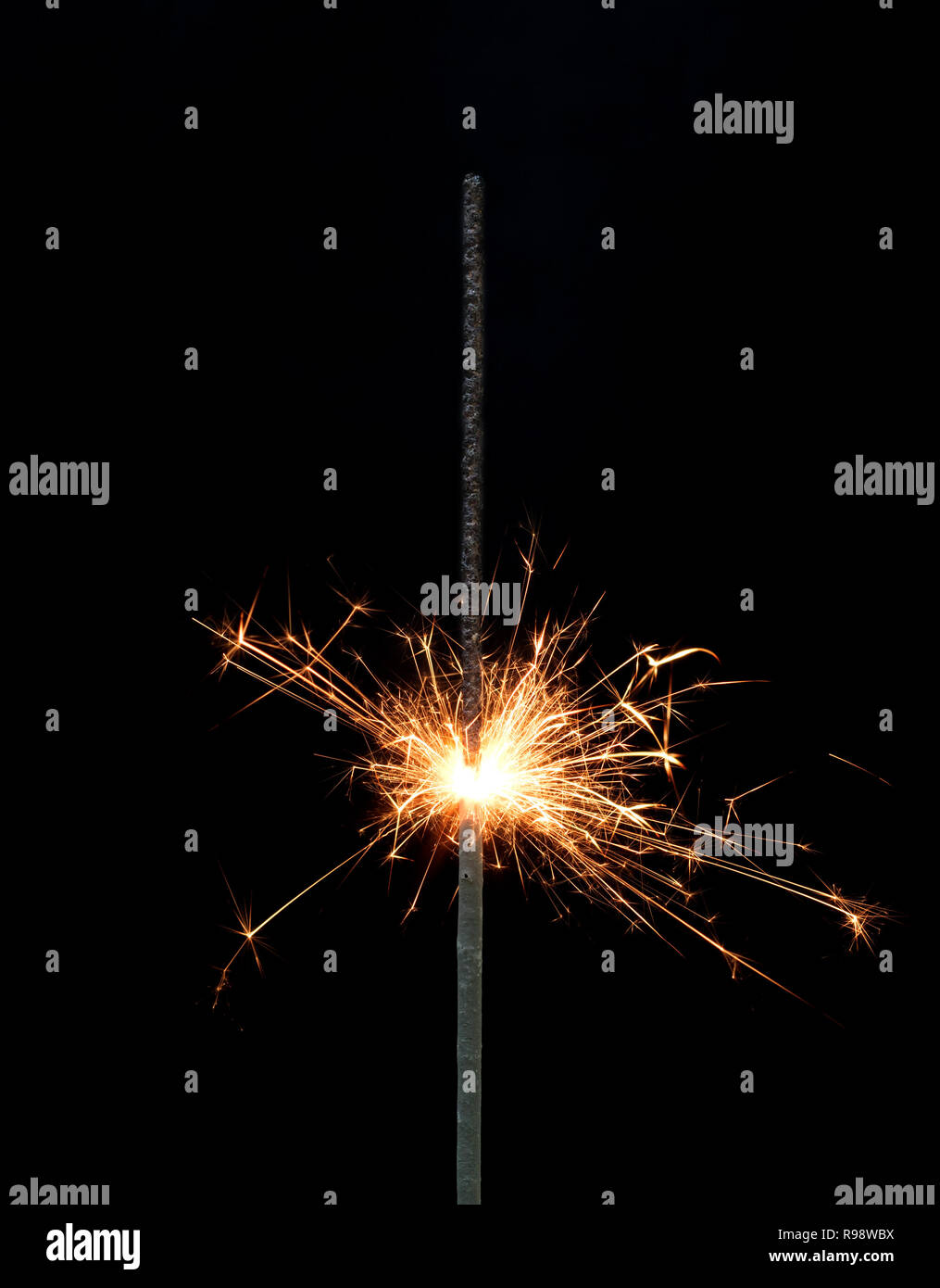 Sparkler isolated on a solid black background Stock Photo - Alamy