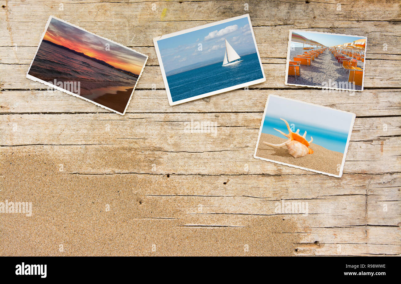 Sand and photographs on planked wood. Summer collage background with ...