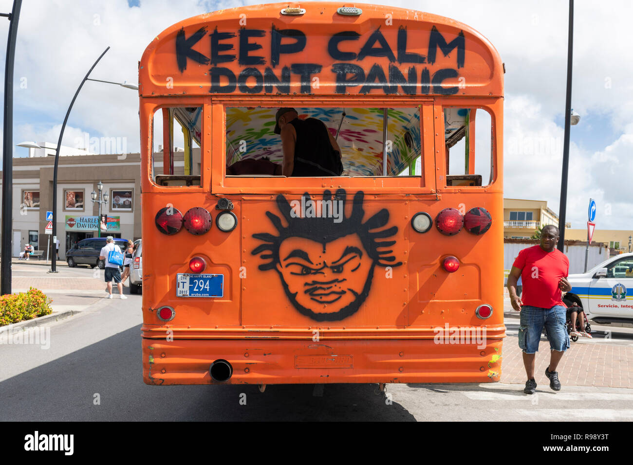 Bright orange tourist bus keep calm don't panic with funny face ...