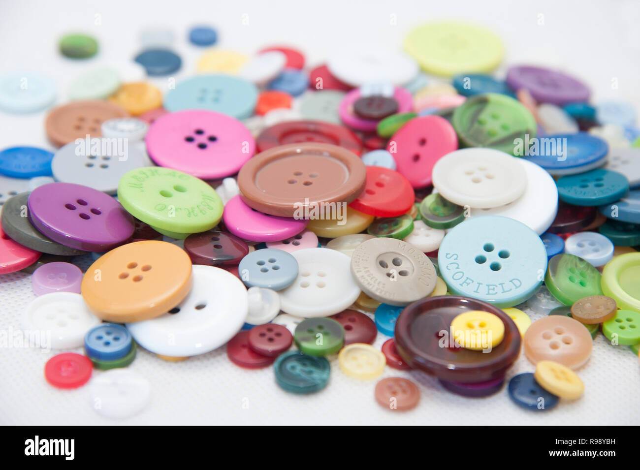 multi-coloured collection of buttons on white background Stock Photo ...