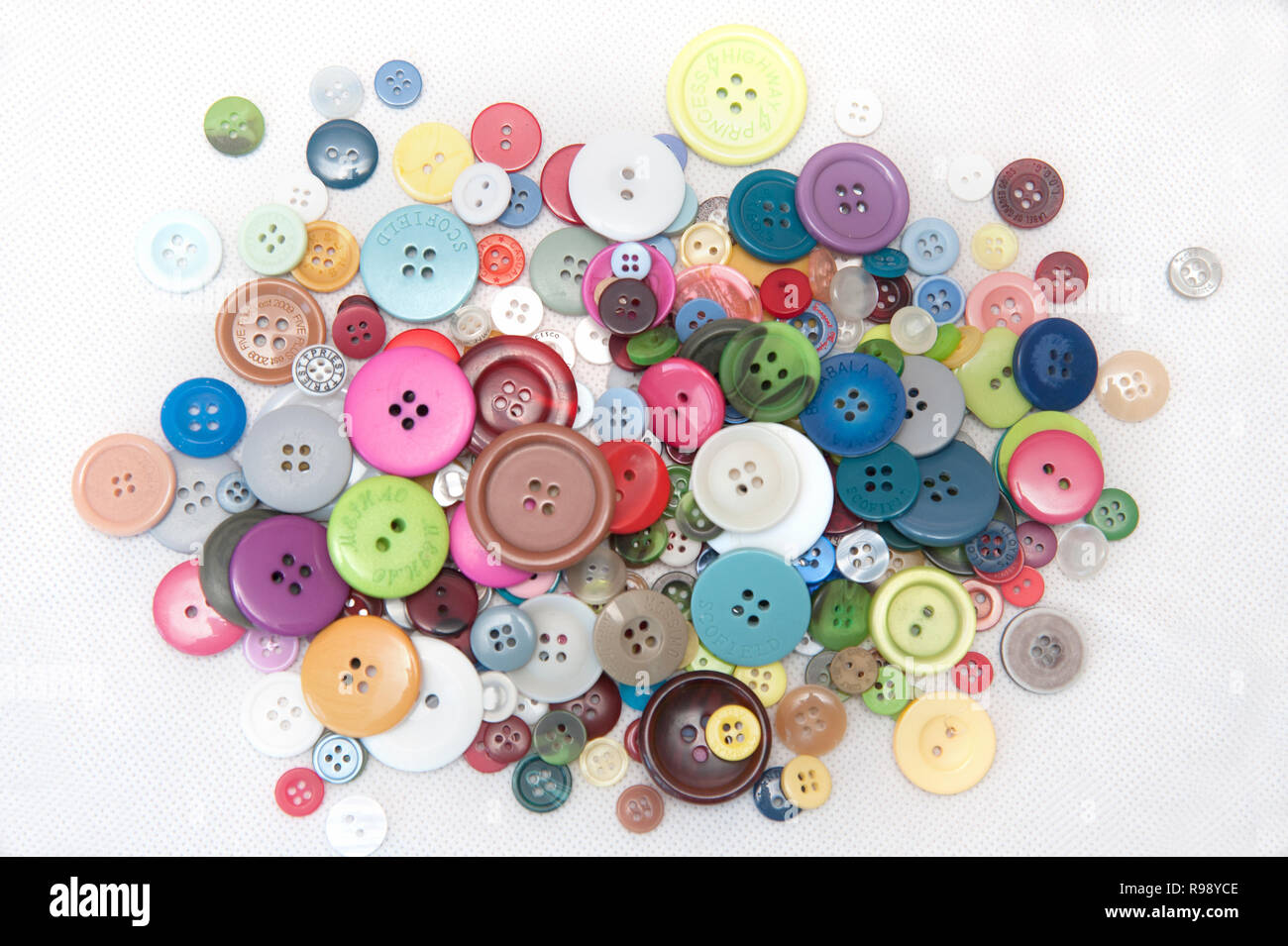 multi-coloured collection of buttons on white background Stock Photo ...