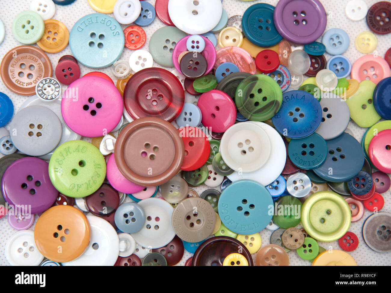 multi-coloured collection of buttons on white background Stock Photo ...