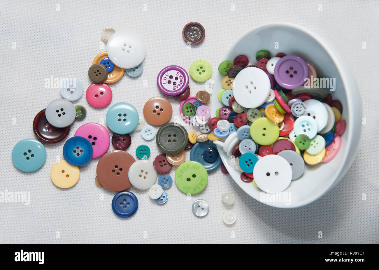 multi-coloured collection of buttons on white background Stock Photo ...