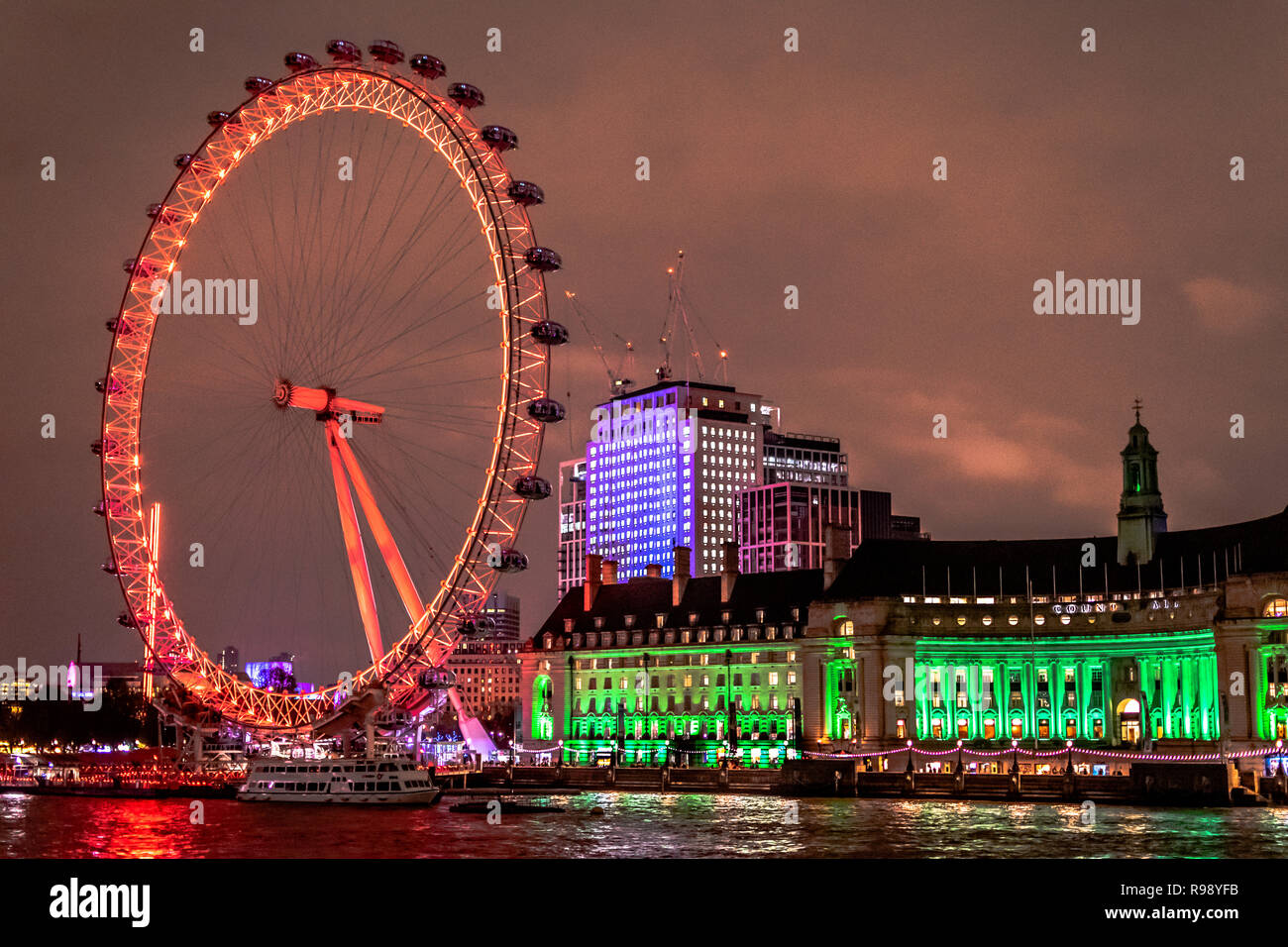a beautiful night photo taken of the London Eye in London from ...
