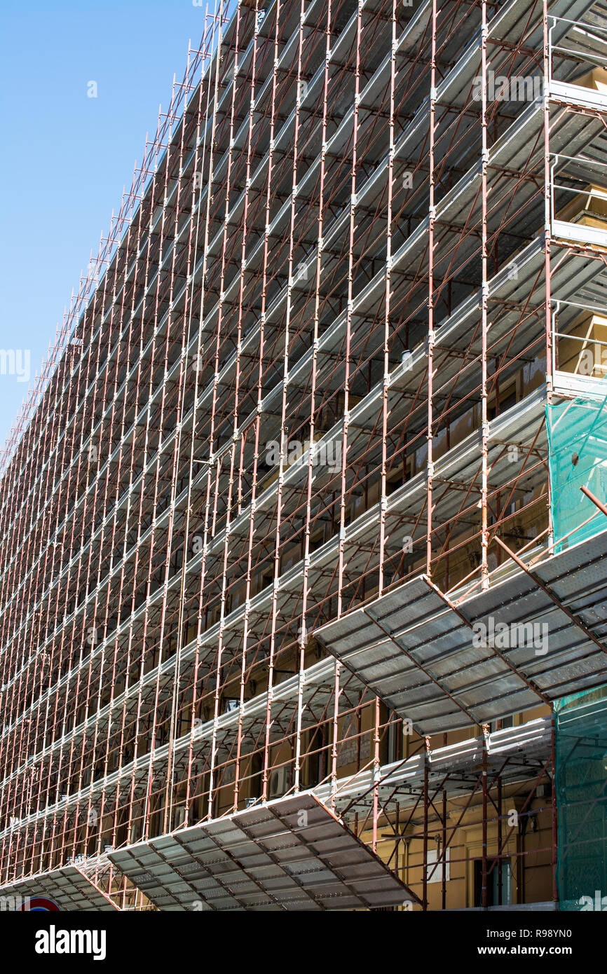The old building with the scaffolding in Rome, Italy. Concept of safety ...