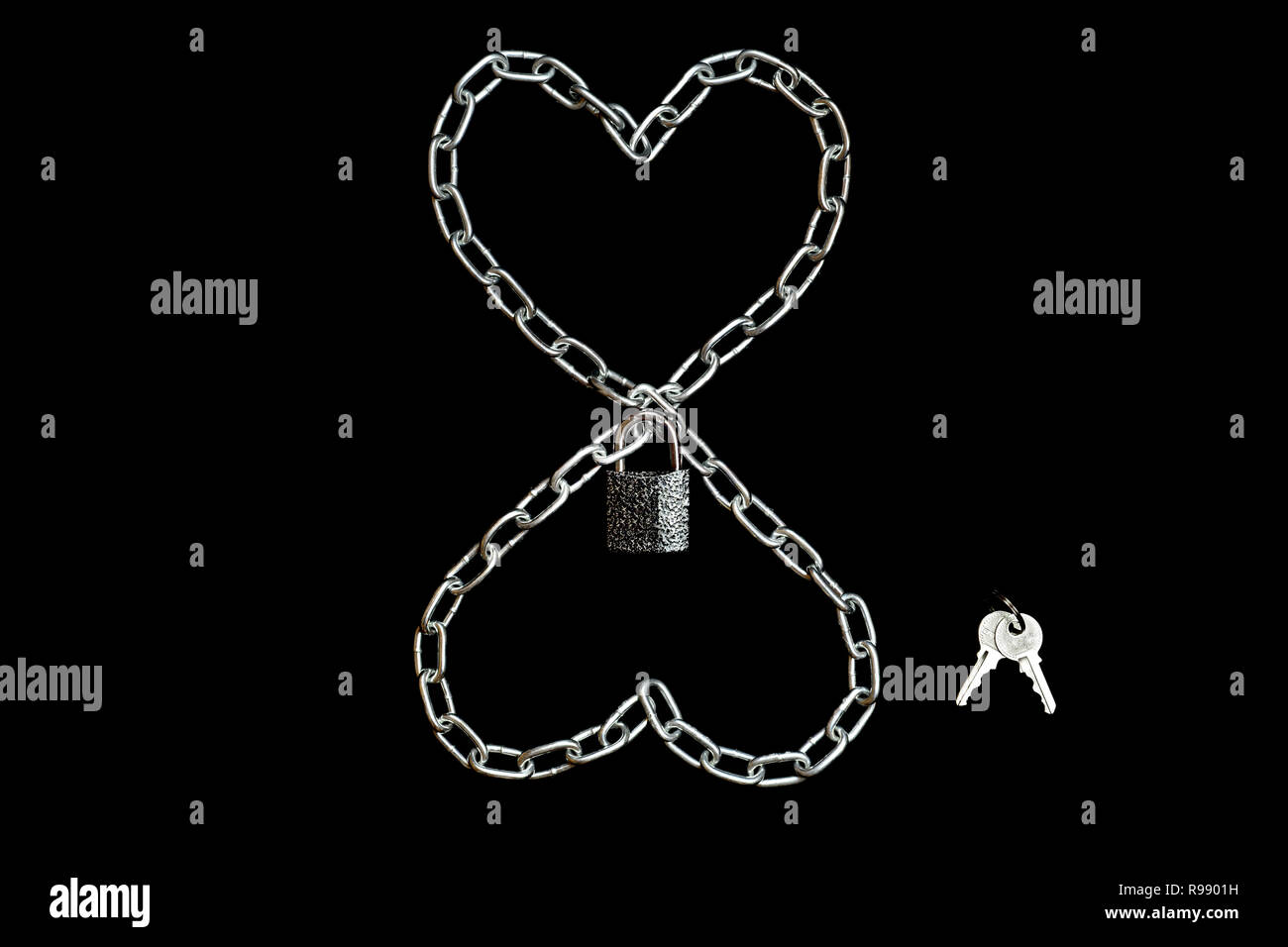 Two chained hearts locked with a padlock with keys on black background ...
