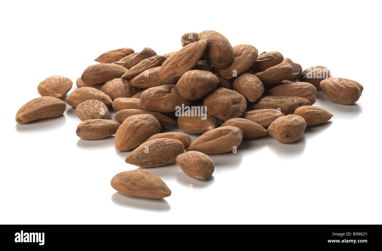 Close up photography of raw almonds heap over white background ...