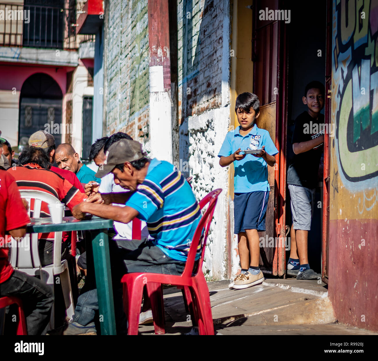 Guatemalan children helping the homeless Stock Photo - Alamy