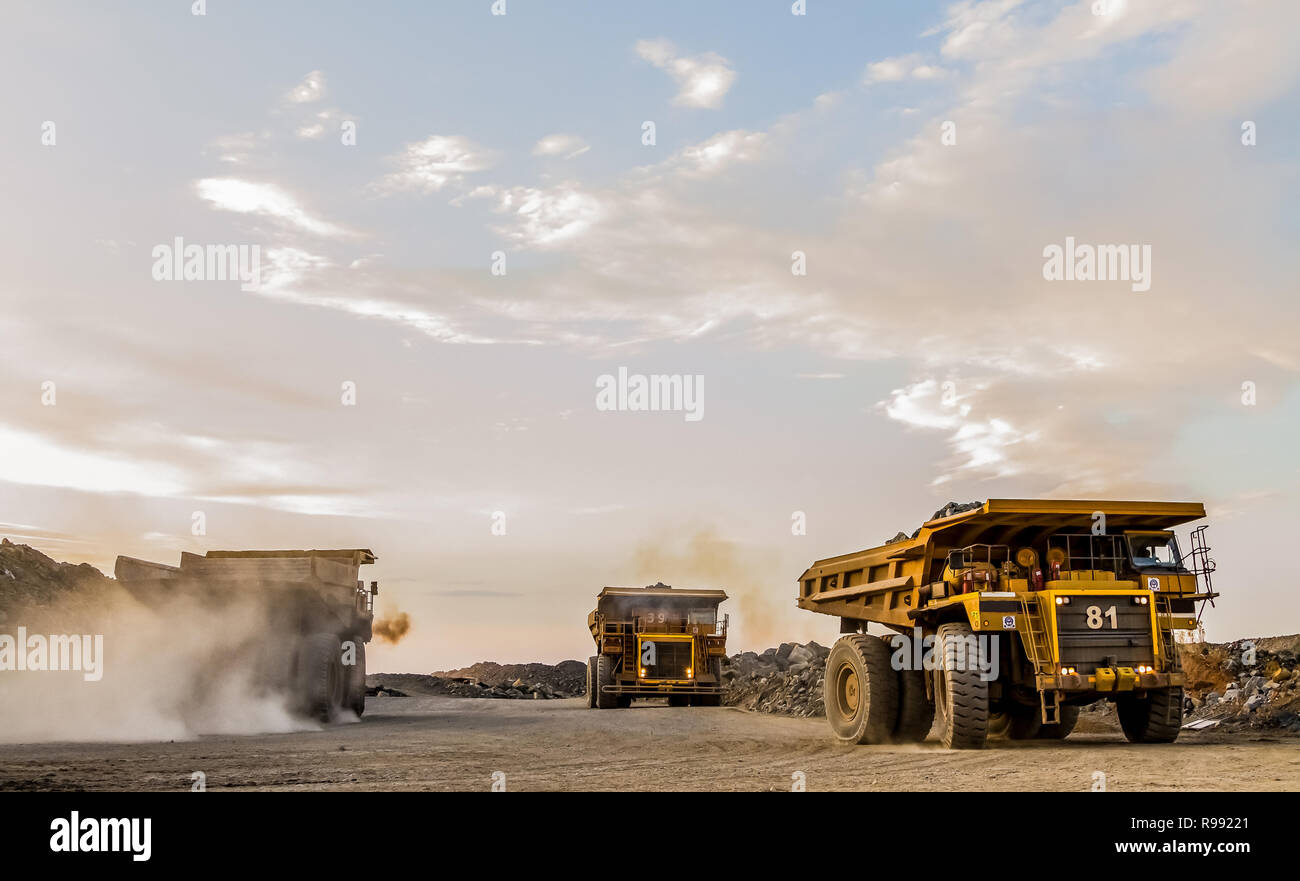 Dump Trucks transporting Platinum ore for processing Stock Photo - Alamy