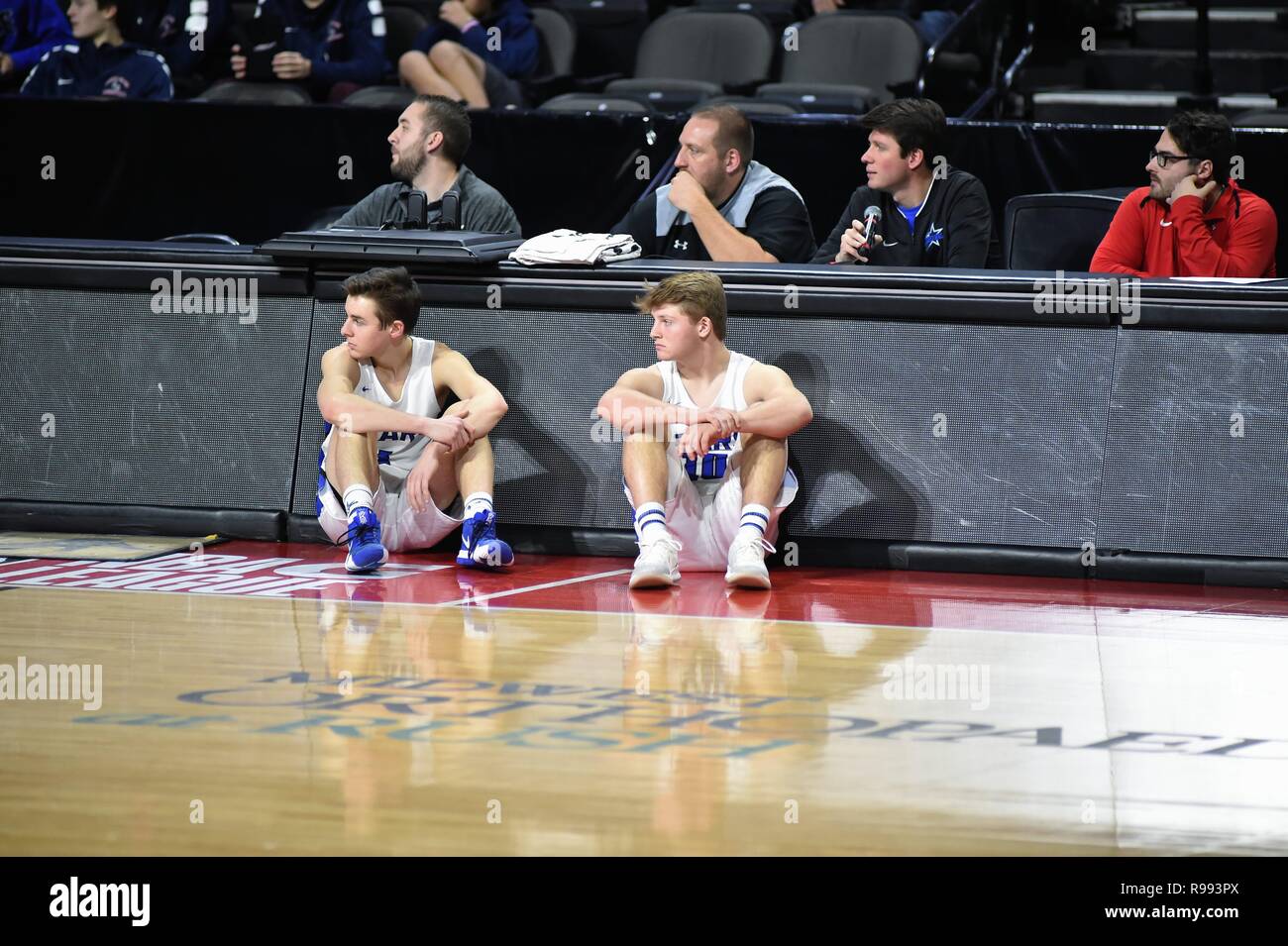 After checking in a the scorer's table, players sit while waiting to ...