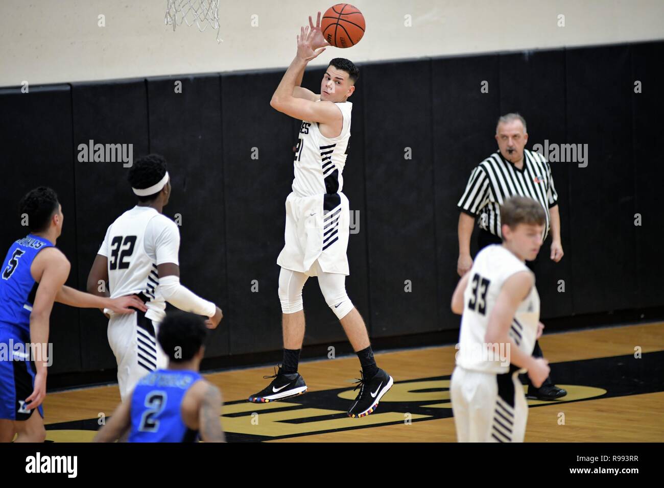 Player pulling down a rebound defensive boards Stock Photo - Alamy