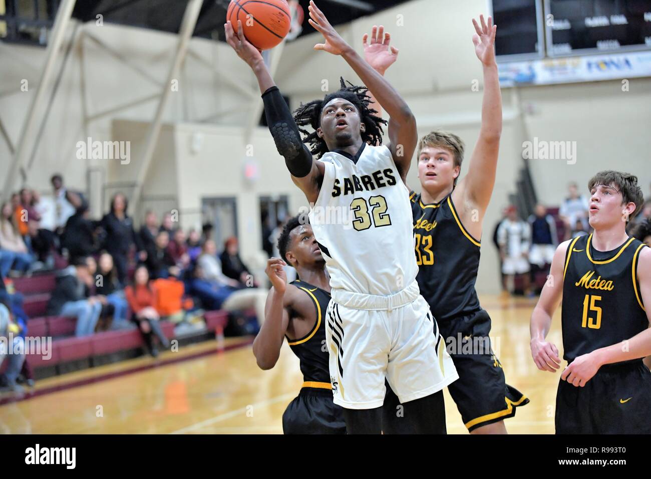 Forward using an inside position to score in front a trio of defenders ...