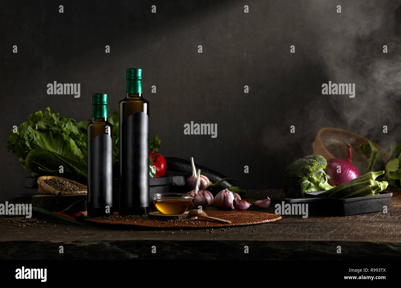 oil and vinegar on wooden table in kitchen Stock Photo - Alamy