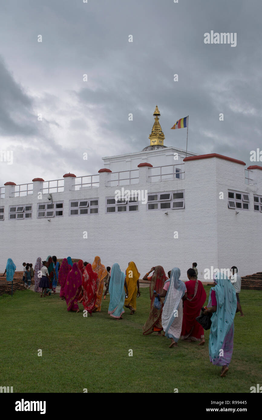 Lumbini, Nepal. Pilgrims walking toward the temple Stock Photo - Alamy