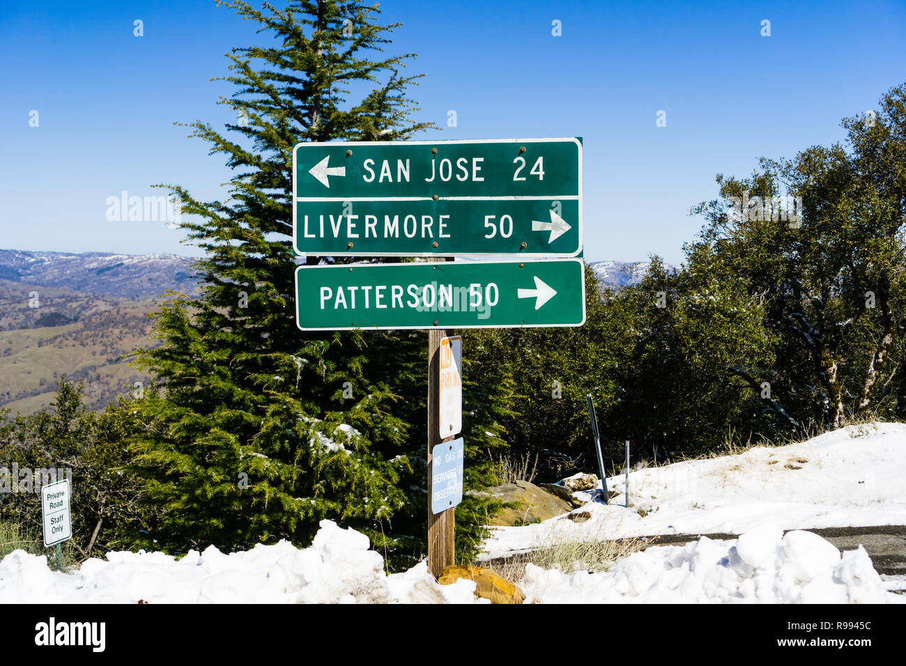 Road directions on top of Mt Hamilton on a rare winter day with snow ...