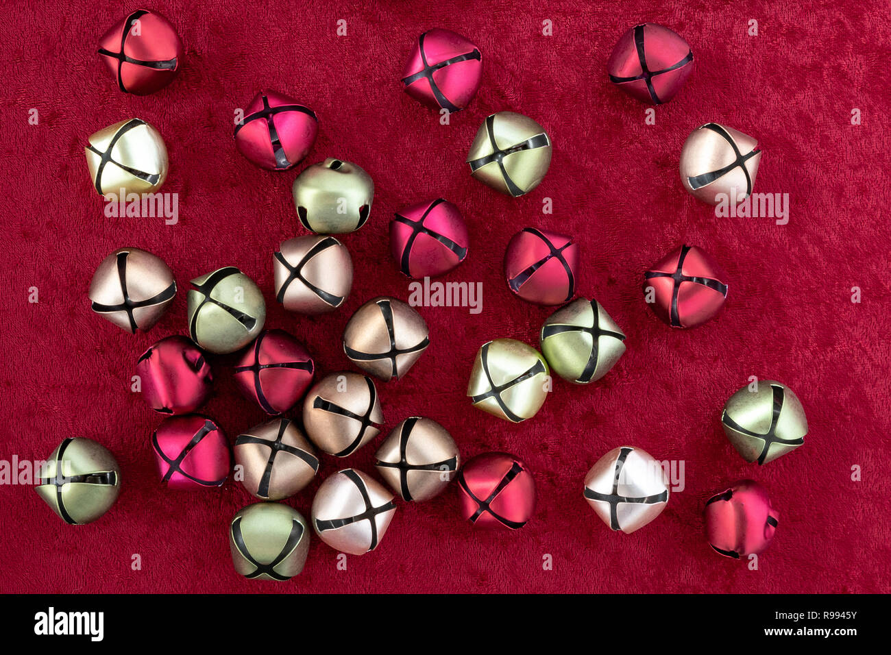 Red, green, gold, and silver scattered on a red velvet background Stock ...