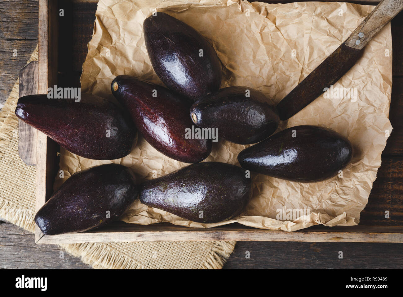 Fresh purple avocado fruits Stock Photo - Alamy
