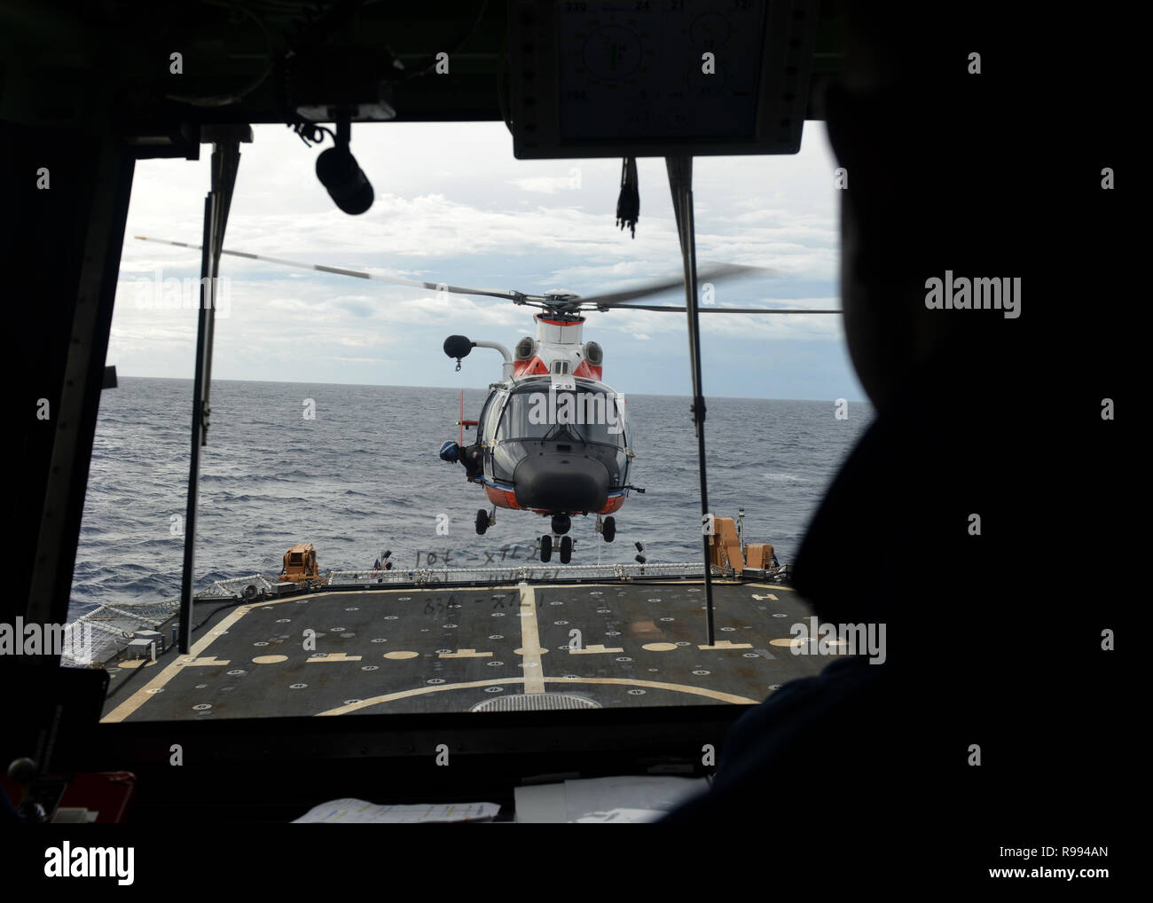 The crew of the Coast Guard Cutter Munro (WMSL 755) conducts air ...